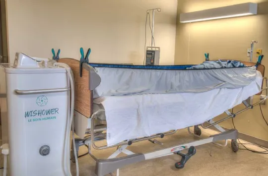 Wishower Portable Bath in Bed Shower System | Shower Gurney Alternative